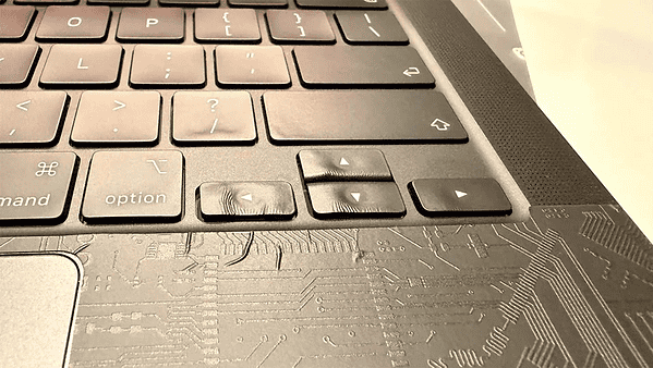 MacBook Pro Owner Used a Hair Dryer and Melted His Keyboard While ...